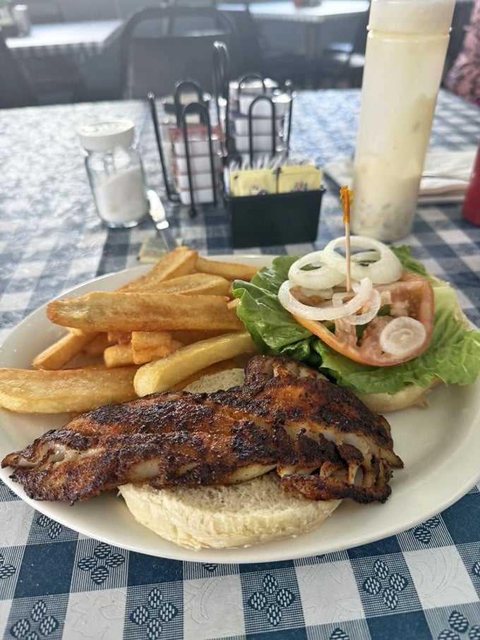 The blackened grouper sandwich—where Florida's waters meet culinary skill. No pretentious "deconstructed" nonsense, just good eating.