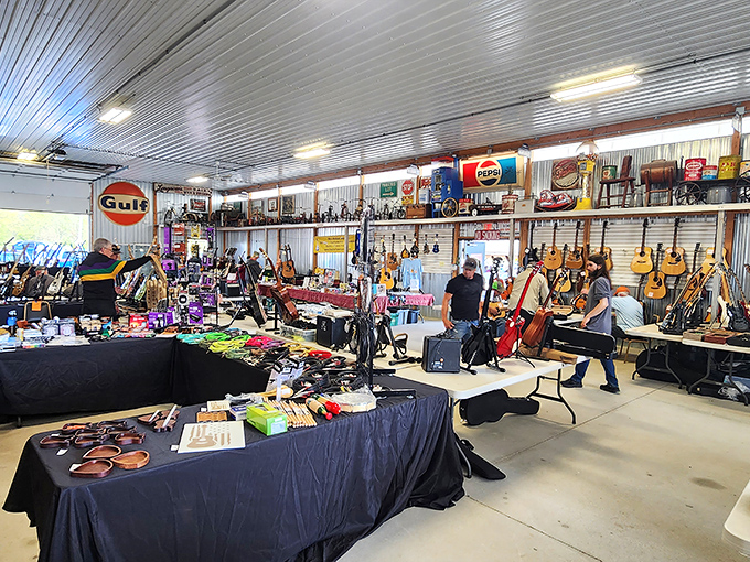 Guitar heaven awaits musicians in this vendor's paradise, where vintage Pepsi signs watch over a congregation of six-strings waiting for their next gig.