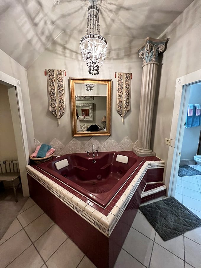 Even King Arthur never had it this good—a heart-shaped jacuzzi beneath a crystal chandelier proves medieval luxury has modern upgrades.