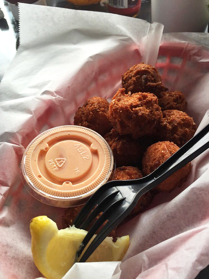 Hush puppies so perfectly golden they deserve their own trophy. That dipping sauce isn't optional – it's mandatory deliciousness.