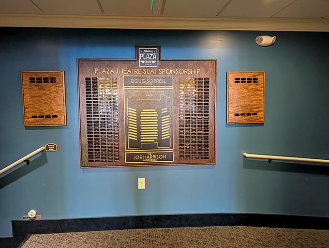 The seat sponsorship wall tells a story of community investment, proving this isn't just another theater—it's Miamisburg's collective living room for film appreciation.