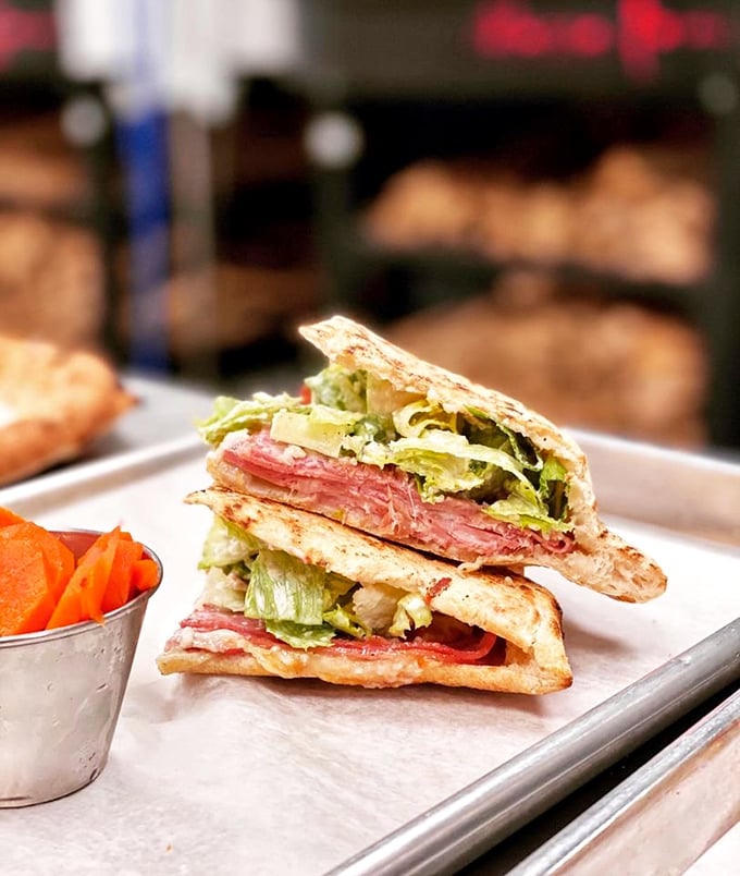 This isn't just a sandwich; it's architecture with salami. Layers of Italian meats and crisp vegetables create the skyscraper of sandwiches that somehow fits in your mouth.
