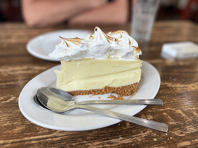 Key lime pie that strikes the perfect balance between sweet and tart—Florida sunshine transformed into a dessert with a golden graham cracker coastline.