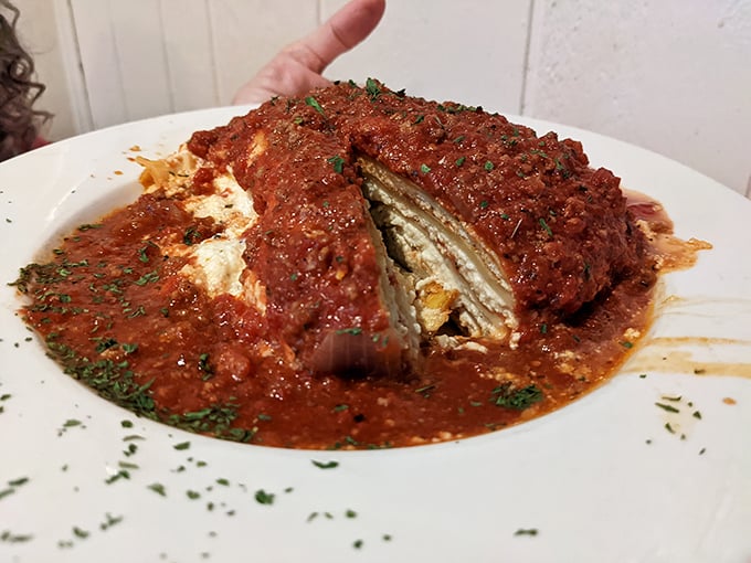 Lasagna that doesn't just sit on the plate—it commands it. That sauce isn't just red, it's a tomatoey declaration of Italian-American love.