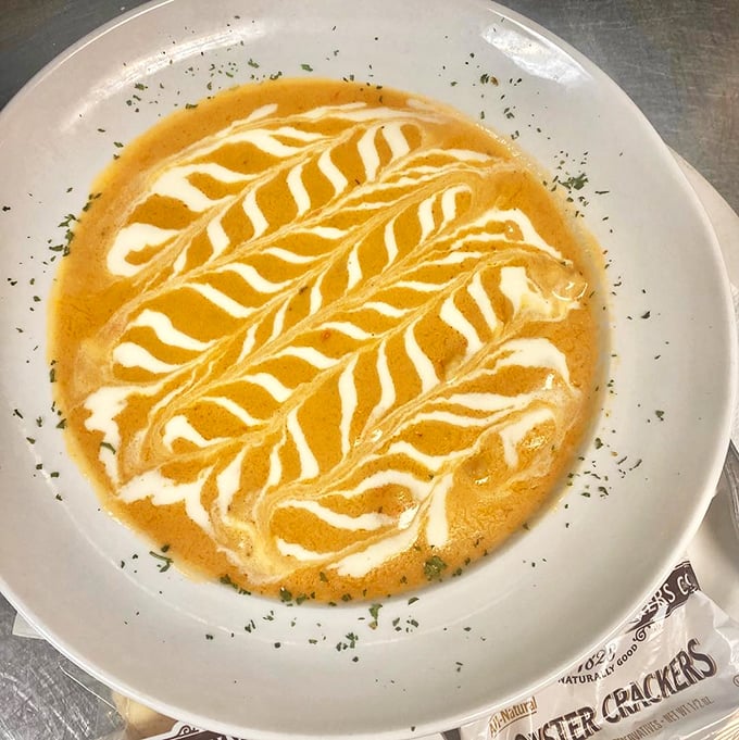 Not just soup—it's a creamy lobster love letter with artistic swirls that belong in the MoMA of maritime cuisine.
