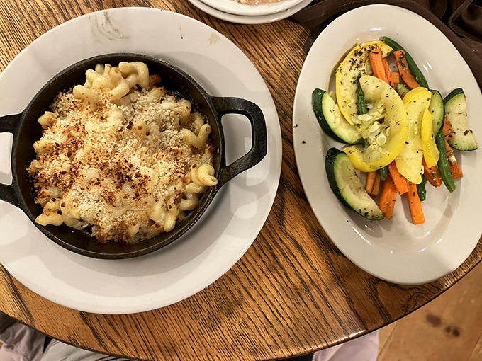 Mac and cheese with a side of perfectly sautéed vegetables—because balance is important when you're about to experience cheese-induced euphoria.