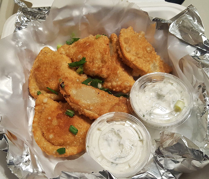 Pierogies: where Eastern European tradition meets American indulgence. These golden pockets of joy come with dipping sauces that demand to be explored. 