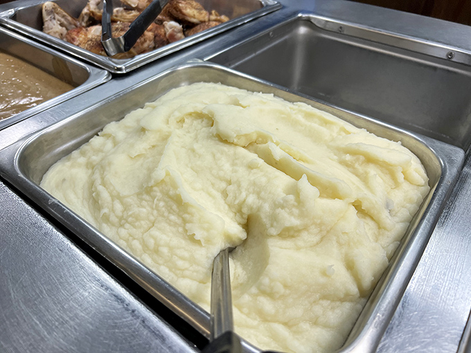 These mashed potatoes aren't just a side dish—they're a fluffy, buttery mountain of comfort waiting for their gravy waterfall moment.