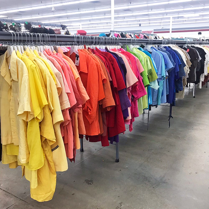 The rainbow road of men's shirts—organized by color with military precision. Somewhere in this spectrum is the Hawaiian print that will define your next vacation.