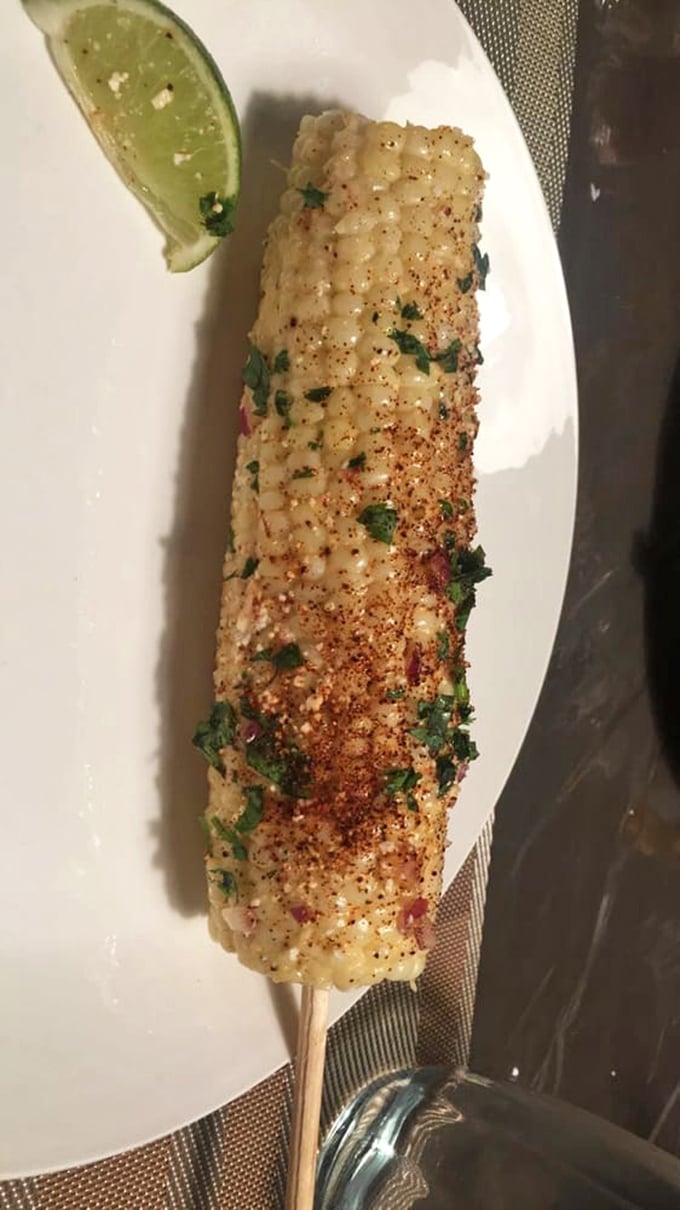 This isn't just corn—it's a vacation to Mexico City on a stick, dusted with spices and lime that'll make your taste buds book the next flight south.