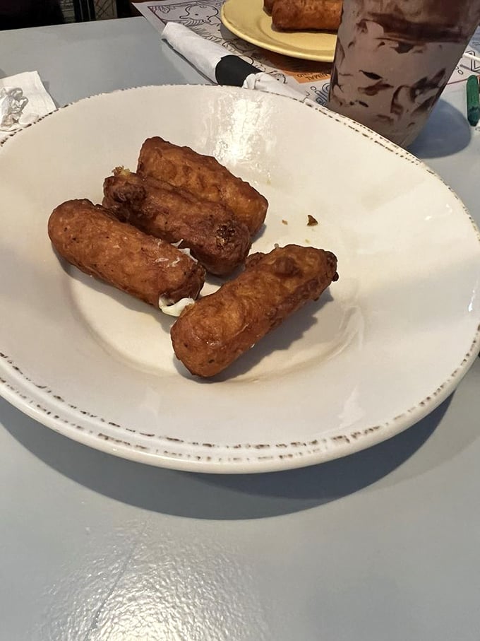 These mozzarella sticks aren't just fried cheese—they're golden cylinders of joy that stretch dramatically with each bite. Wisconsin would approve. 