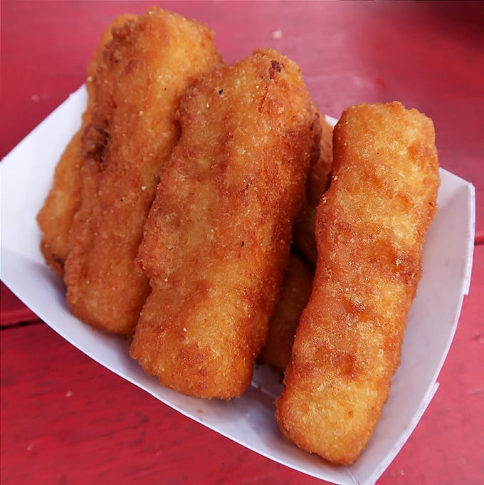 Golden-brown treasures that shatter with that perfect crunch before revealing their molten, stretchy centers—the supporting actors who steal scenes.