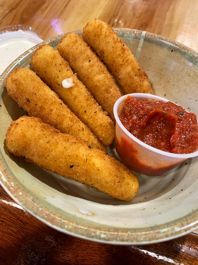 Mozzarella sticks done right – crispy exterior giving way to that perfect cheese pull that deserves its own slow-motion sequence in a food documentary.
