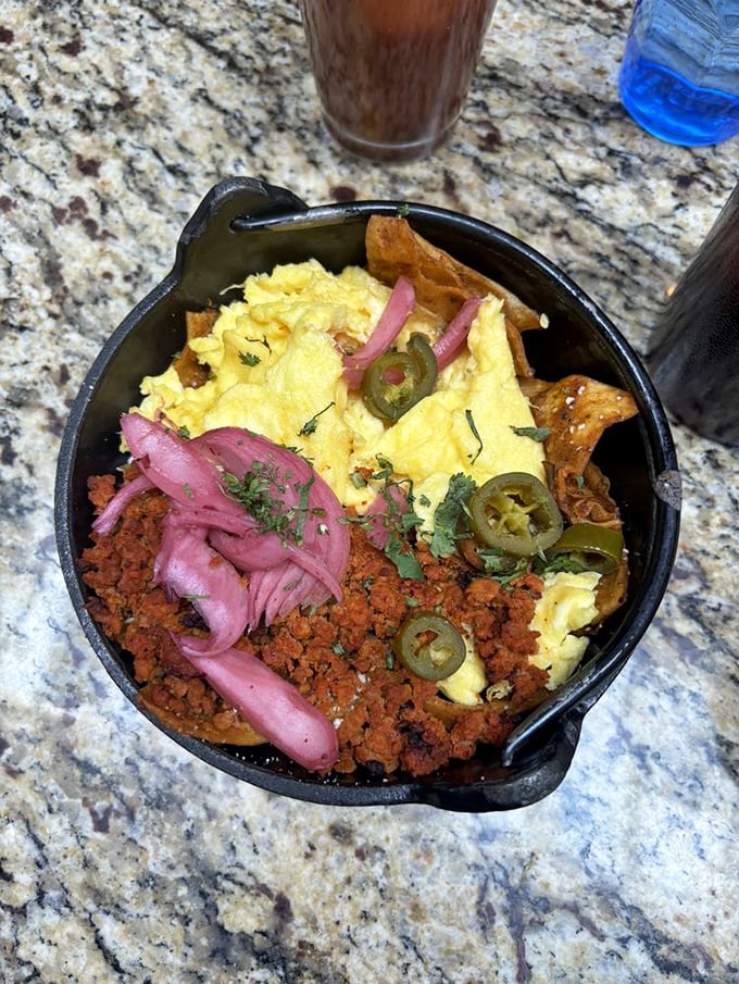 Breakfast skillet magic—where eggs, chorizo, and pickled onions perform a morning symphony. The jalapeños are there for the high notes.