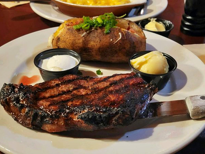 A perfectly grilled New York Strip with classic steakhouse accompaniments—proof that some traditions deserve to be preserved like fine art.