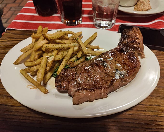 This New York strip doesn't need Broadway lights to be a star—just a perfect char, seasoned crust, and those gloriously crisp fries.