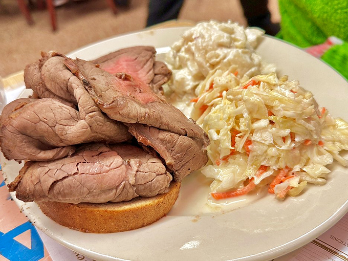 Behold the open-faced masterpiece – where the bread serves merely as a stage for the star performer: perfectly pink, impossibly tender roast beef.