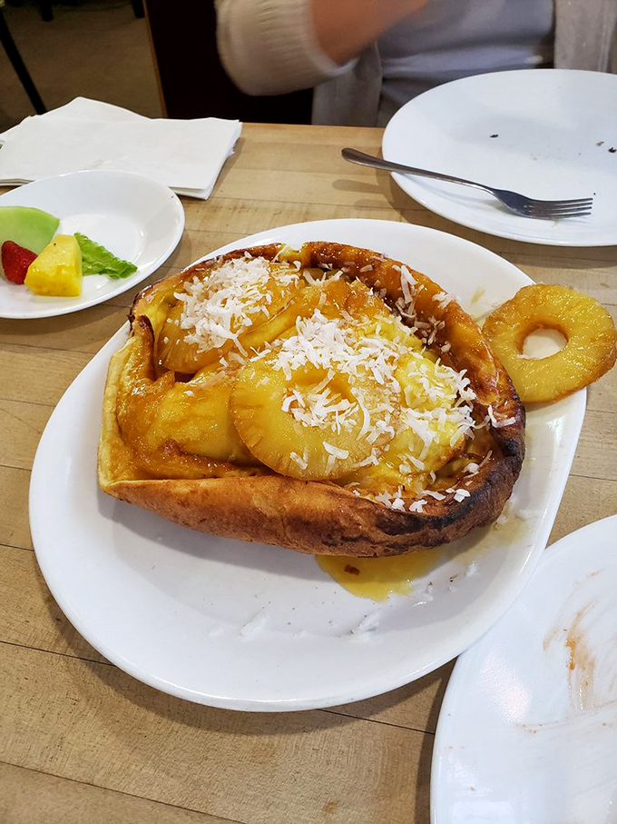 Pineapple paradise on a plate – where tropical fruit meets golden pancake in a vacation for your taste buds, no passport required.