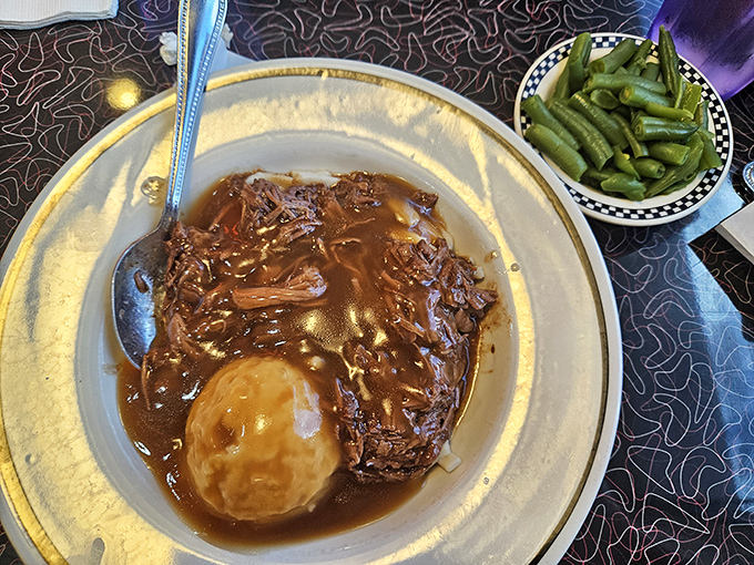 Pot roast that falls apart at the mere suggestion of a fork, swimming in gravy that should be bottled and sold as liquid comfort.