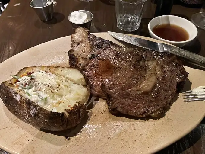 A prime rib that doesn't just raise the steaks, it dominates them. Paired with a loaded baked potato that's practically a meal unto itself.