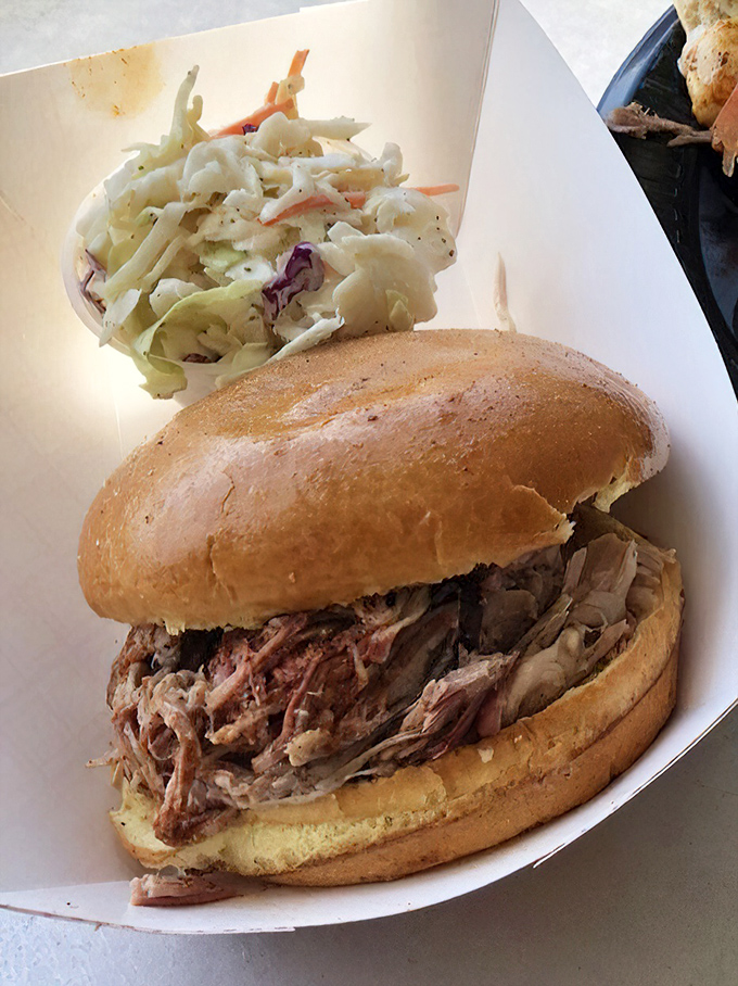 The humble pulled pork sandwich – proof that sometimes the simplest pleasures deliver the most profound satisfaction.