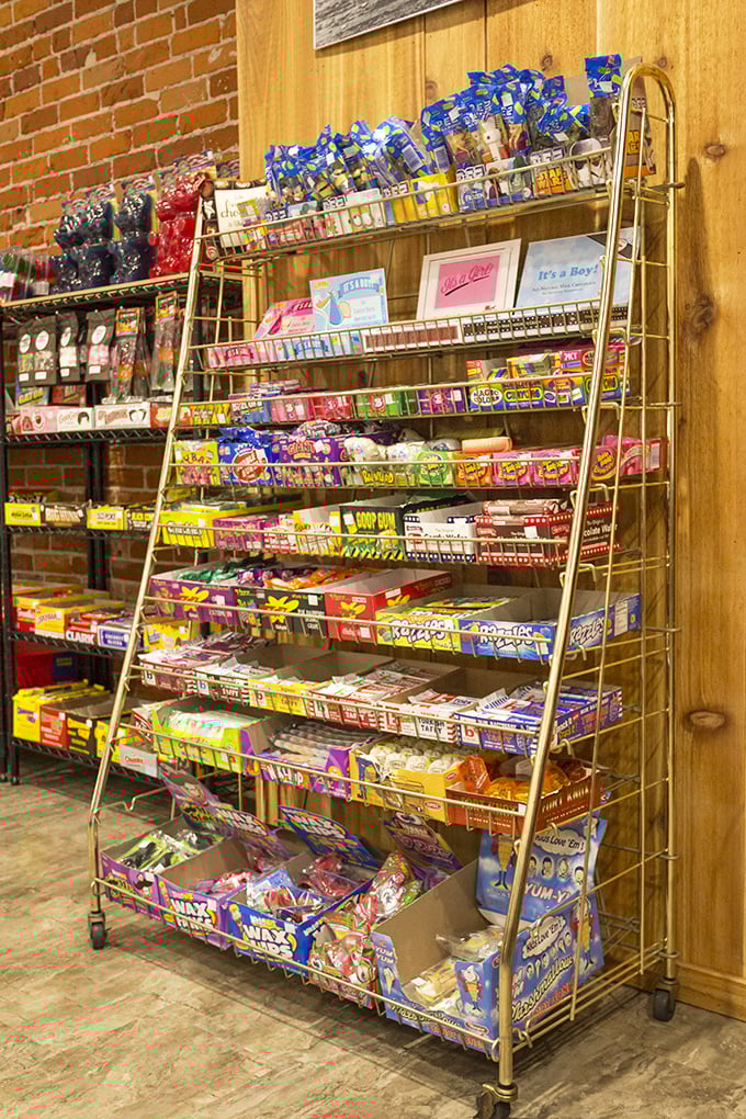 This golden candy rack isn't just a display—it's a nostalgia machine dispensing childhood memories by the boxful.