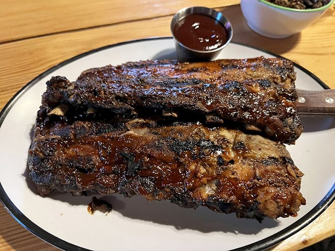 These ribs aren't just fall-off-the-bone tender – they've already packed their bags and moved out. Glistening with sauce and beckoning for your attention.