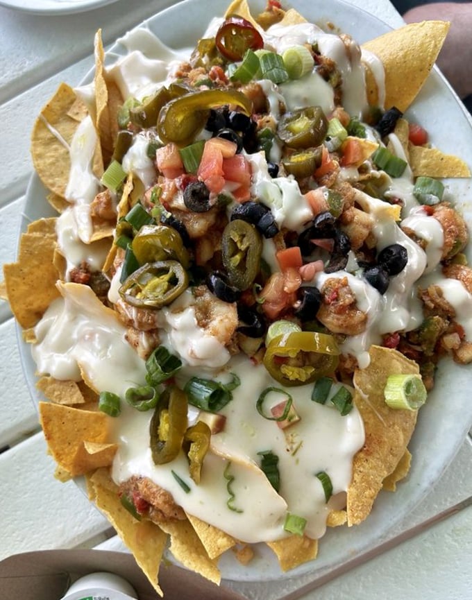 Seafood nachos that could make a grown adult weep with joy. The jalapeños aren't just garnish—they're exclamation points on a crunchy, cheesy masterpiece.