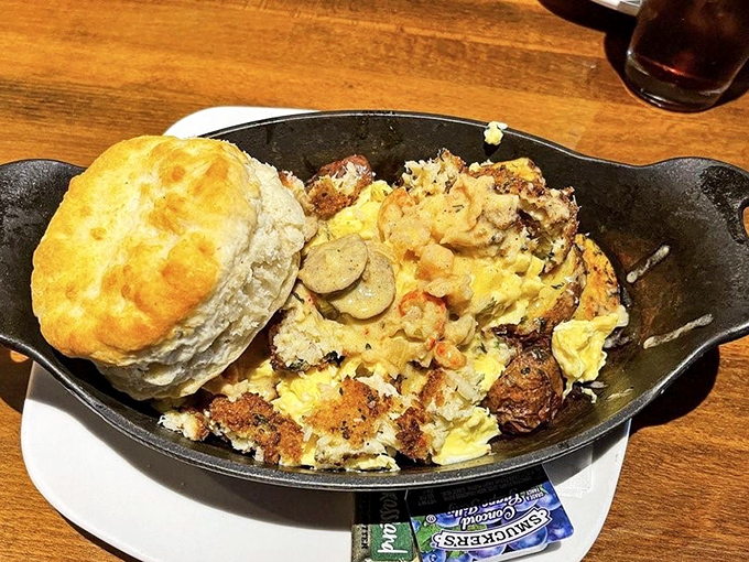 Breakfast skillet magic! A fluffy biscuit crowns this hearty mix of eggs, potatoes, and savory goodness—the kind of dish that makes mornings worthwhile.