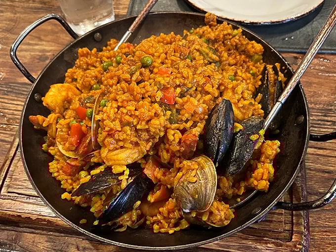 This seafood paella isn't just a dish; it's an edible postcard from the Mediterranean that somehow got mailed to Delaware.