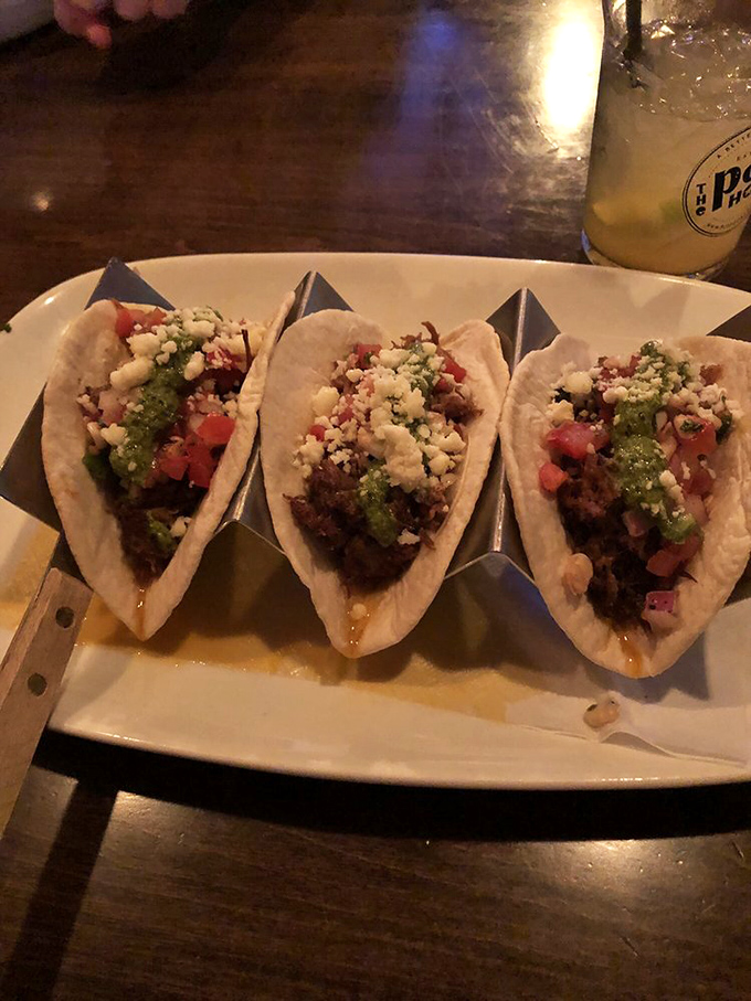 Tacos that don't just satisfy hunger but spark joy. The crumbled cheese and vibrant toppings are like tiny flavor festivals in each bite.