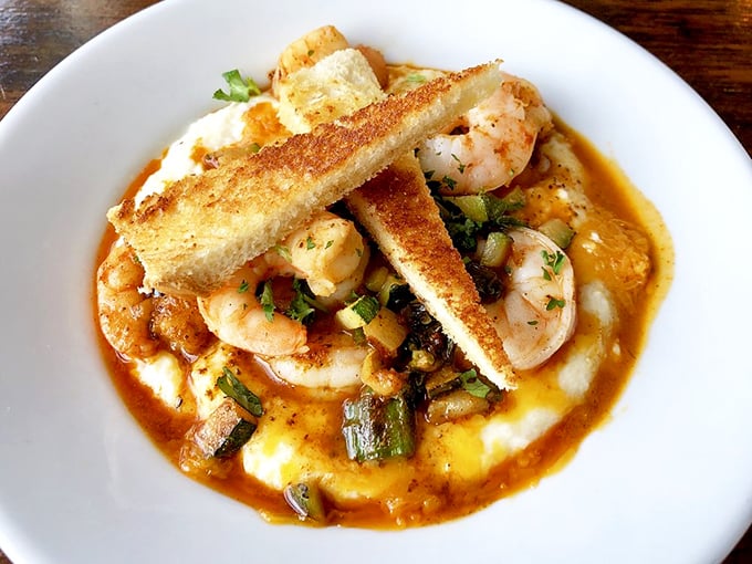 Shrimp and grits elevated to an art form – the kind of dish that makes you temporarily forget your table manners as you scrape up every last luxurious bite.