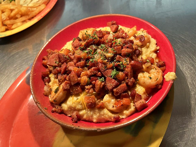 Creamy grits crowned with plump shrimp and crispy bacon bits—this dish doesn't just speak Southern, it sings it with a full gospel choir.