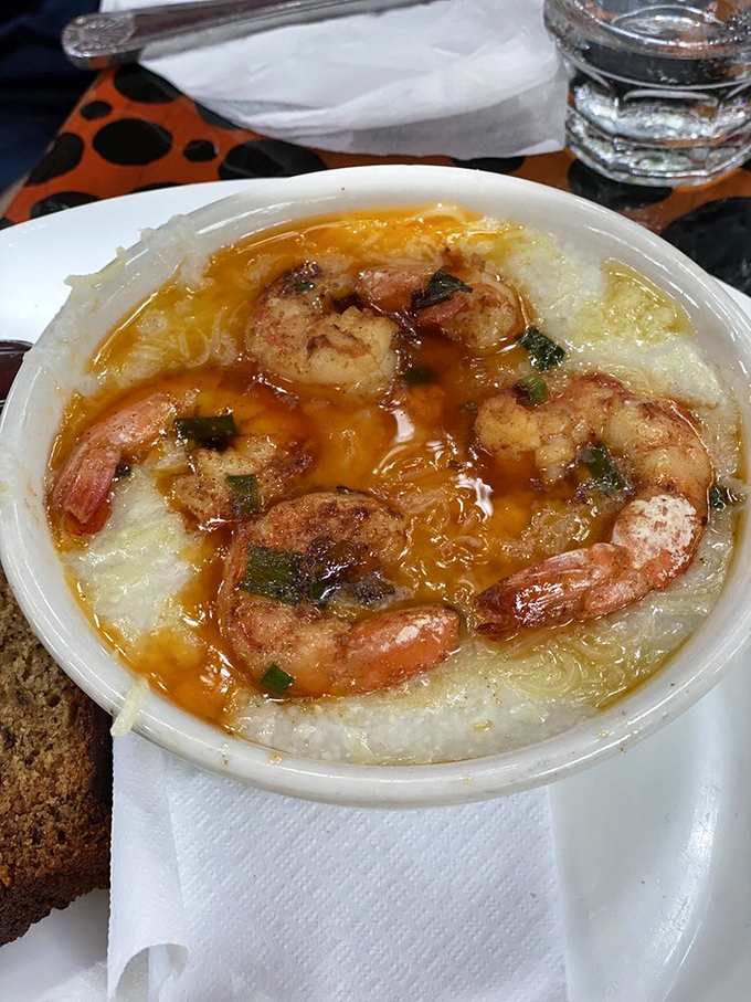 Shrimp and grits elevated to an art form—plump Key West pink shrimp lounging in creamy grits like they're on vacation too.