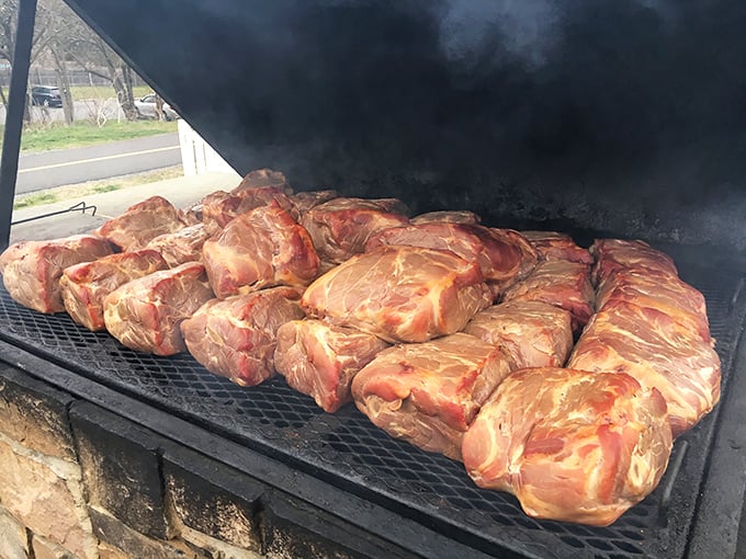 Meat transformation in progress—these pork butts aren't just cooking, they're undergoing a spiritual journey toward barbecue enlightenment.