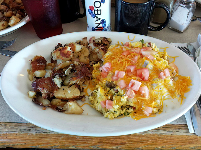 Behold the Southern Scrambler—where potatoes and eggs unite with cheese in a breakfast alliance that would make any morning person salute.