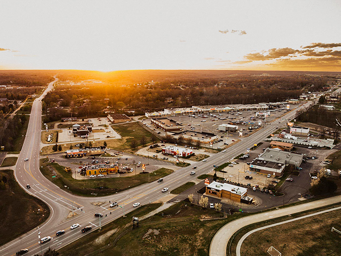 Golden hour transforms Poplar Bluff's commercial district into a canvas of warm light, casting long shadows across the town's everyday rhythms.