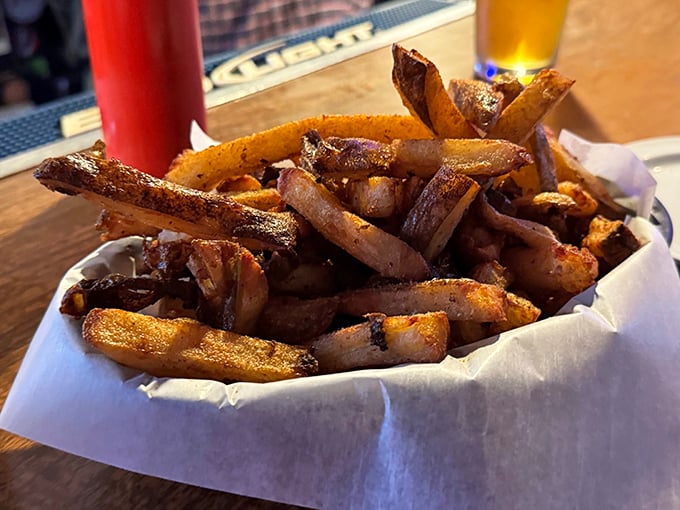 These aren't just fries – they're golden-brown treasures that make you question why regular potatoes even bother showing up to work.