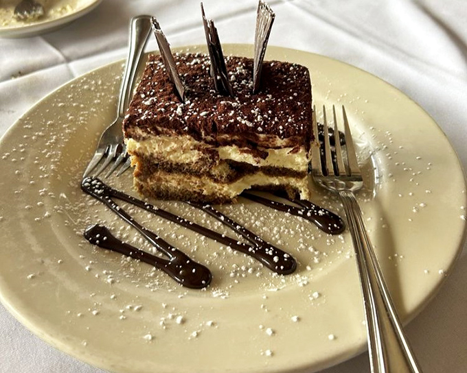 Layers upon layers of coffee-soaked goodness—this tiramisu is what Italian dreams are made of, with chocolate accents that deserve their own museum exhibit.