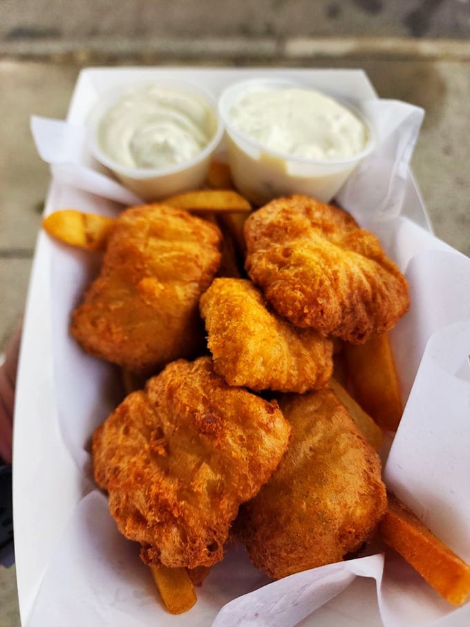 The whole order arrives like edible gold bullion—five perfectly fried pieces of albacore tuna that make you consider moving to Astoria permanently.