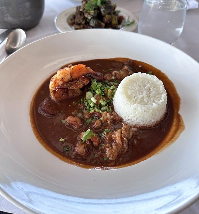 Gumbo that could make New Orleans jealous – rich, complex flavors dancing around tender seafood and a perfectly formed rice island.