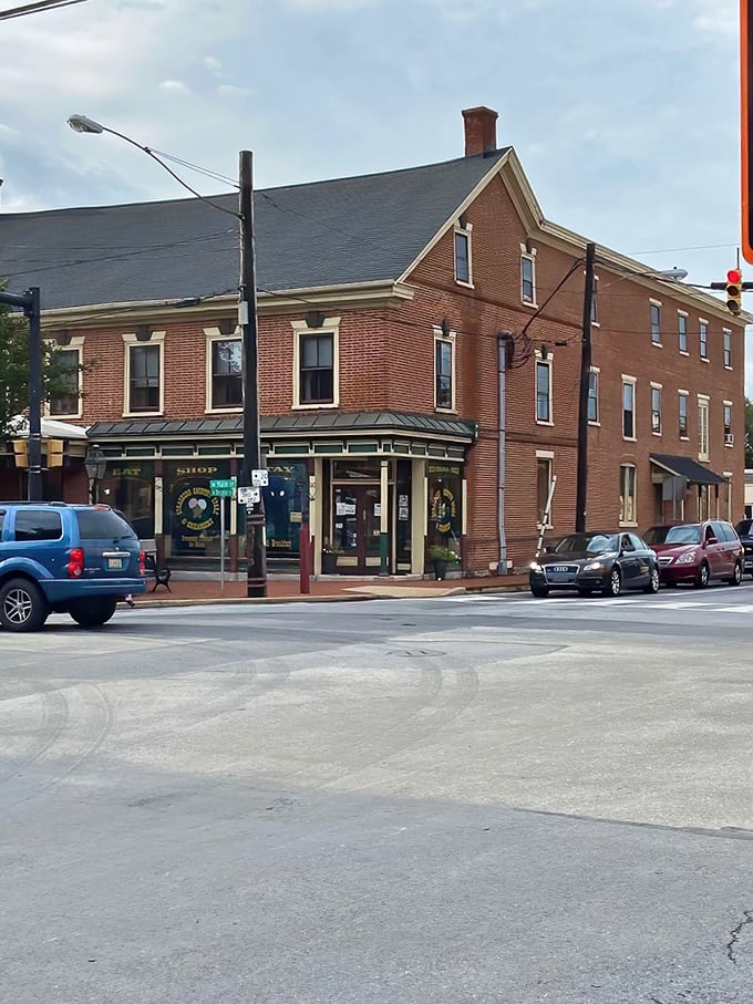 Corner buildings in Strasburg don't just occupy space—they command it, with their brick facades and green awnings practically begging to be featured in a Hallmark holiday movie.