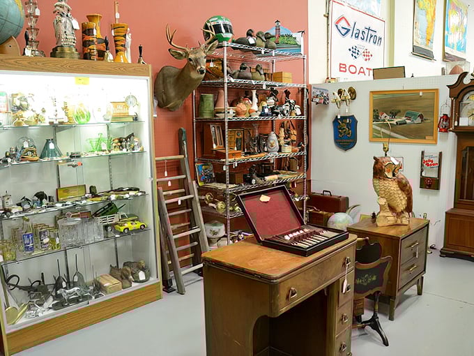 The hunter's den meets collector's paradise—where taxidermy, vintage office furniture, and shelves of curiosities create the ultimate man cave inspiration.