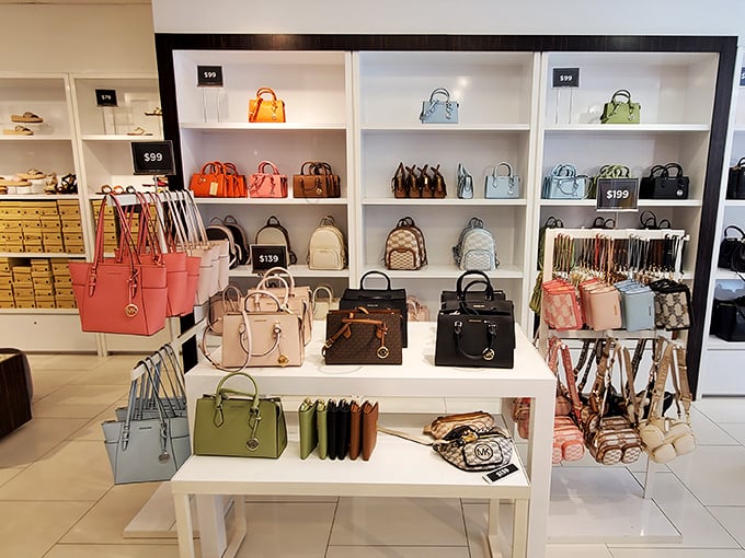 Designer handbags arranged like museum exhibits—except here, touching is encouraged and taking one home is the point.
