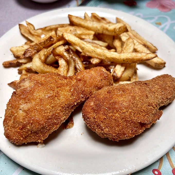 Barberton-style chicken: where crispy, golden exterior meets juicy interior in a marriage so perfect it should have its own reality show.