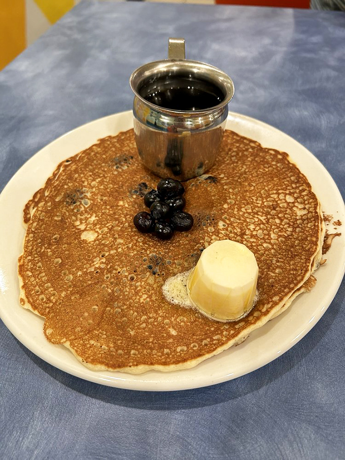 The pancake that launched a thousand return visits. Thin, crispy-edged, and topped with blueberries and butter—breakfast nirvana achieved.