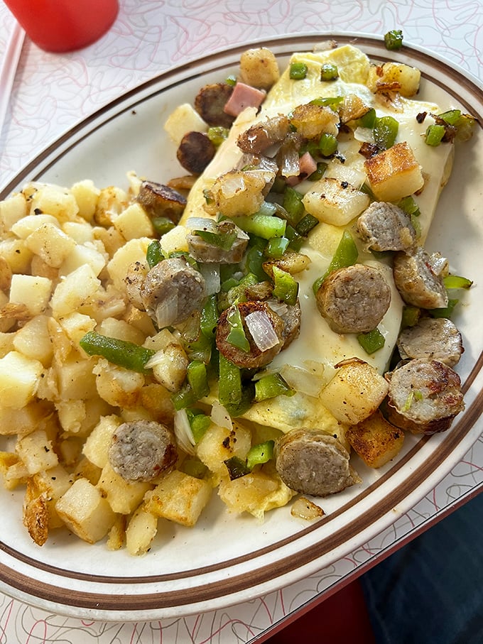Breakfast alchemy at its finest—where eggs, potatoes, and sausage transform into a morning symphony that puts cereal to shame.