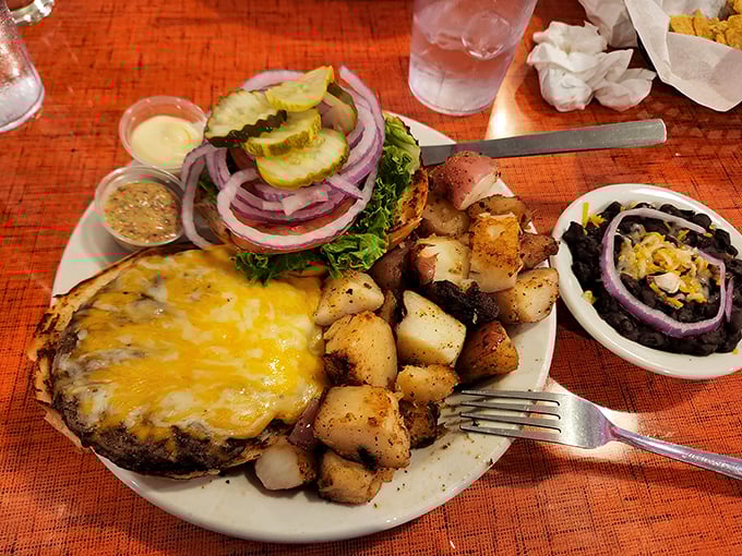 A burger that makes you wonder why some people only eat breakfast here—this plate has enough substance to fuel an entire afternoon of weird Austin adventures.