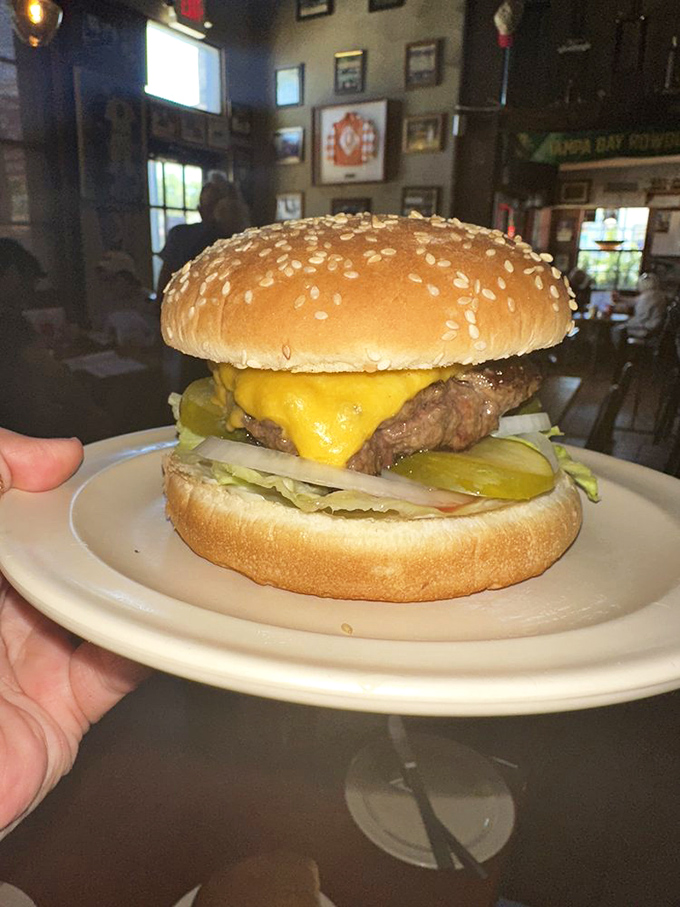 Behold the star of the show! This perfectly proportioned cheeseburger doesn't need frills—just proper execution and the right melty-to-meaty ratio.