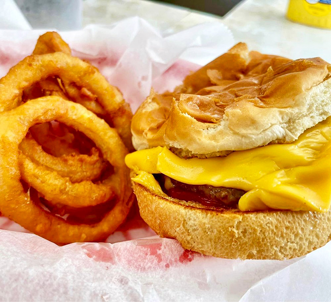 The cheeseburger and coleslaw combo—proof that sometimes the simplest pleasures are the ones that keep you coming back for decades.